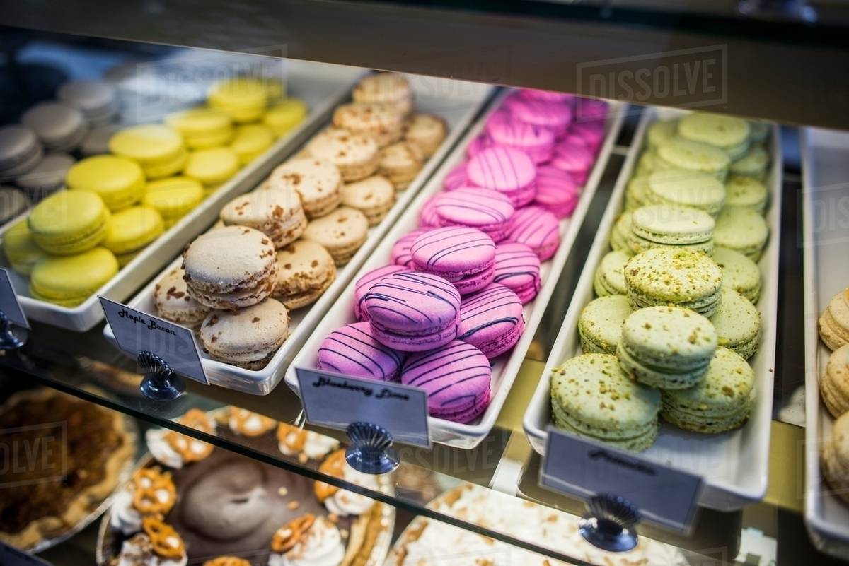 Macarons in trays in display cabinet, close-up - Royalty-free Stock ...