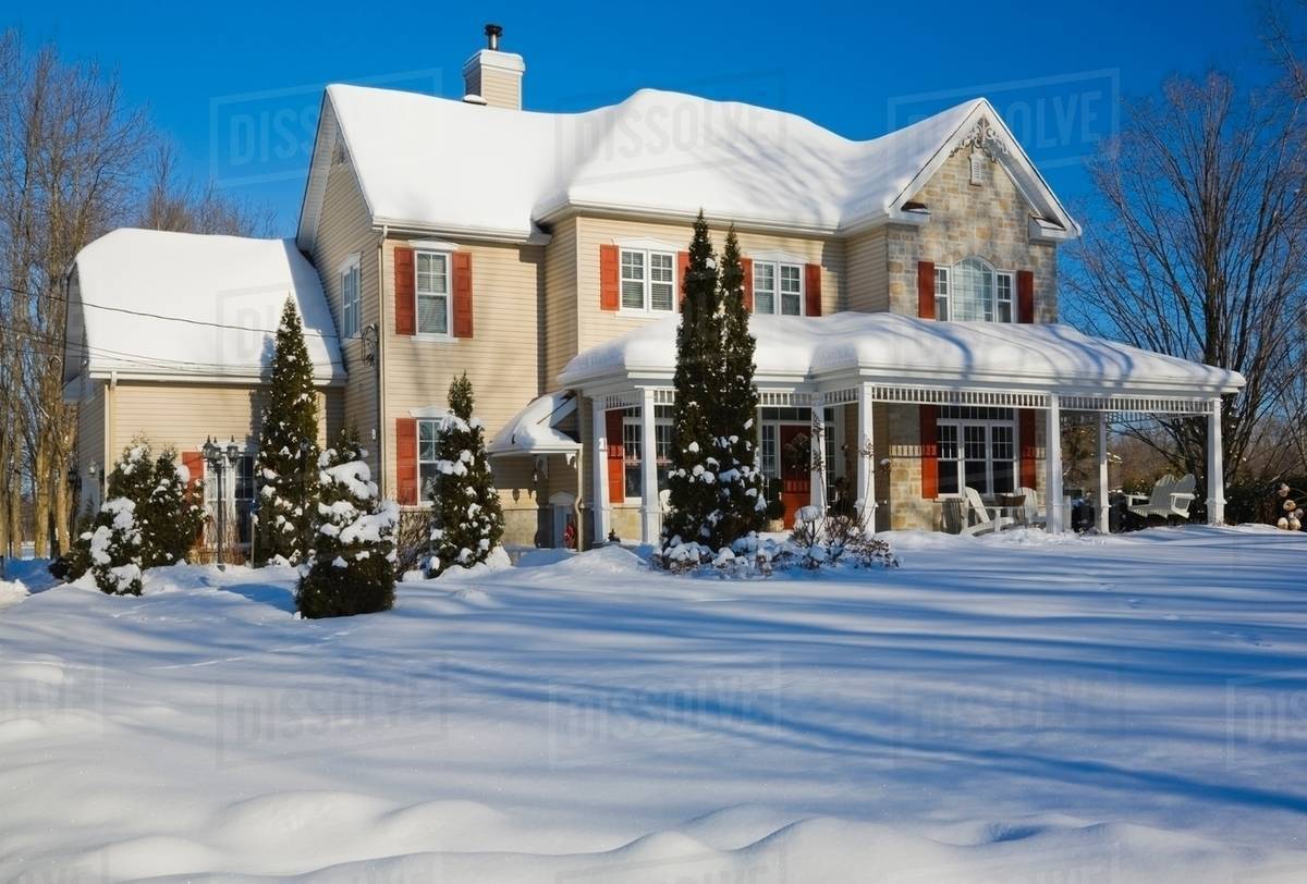 House in winter, Quebec, Canada - Stock Photo - Dissolve