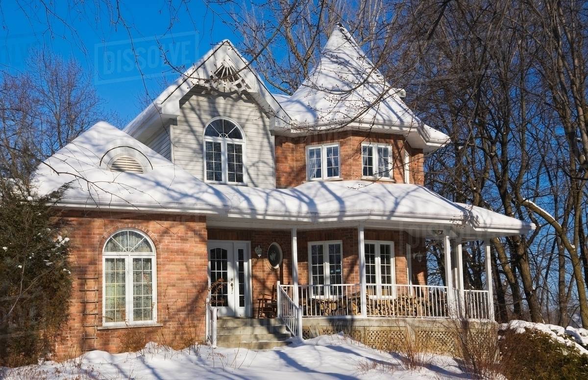 Red brick Victorian cottage style home in winter, Quebec, Canada ...