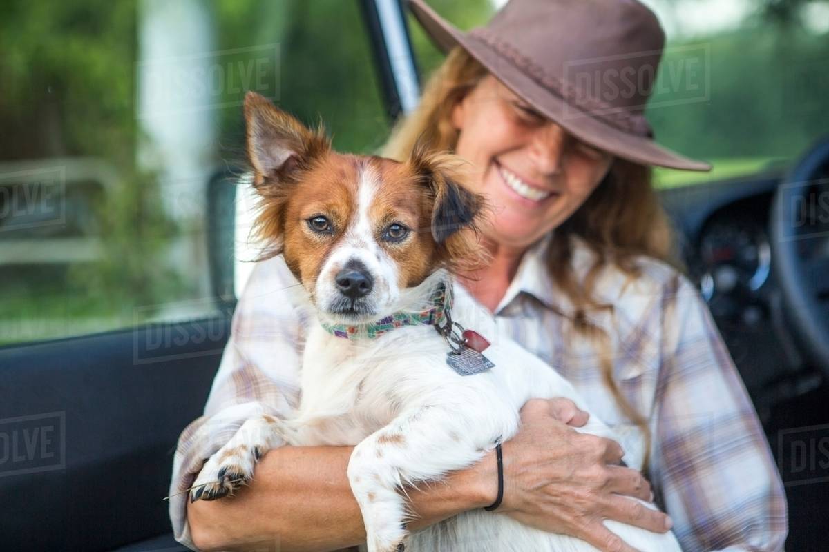 Portrait of mature woman with dog - Royalty-free Stock Photo | Dissolve