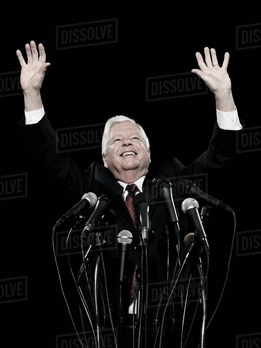 Politician with hands raised - Royalty-free Stock Photo | Dissolve