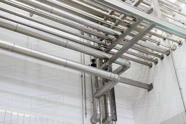 Industrial piping in a factory - Royalty-free Stock Photo | Dissolve