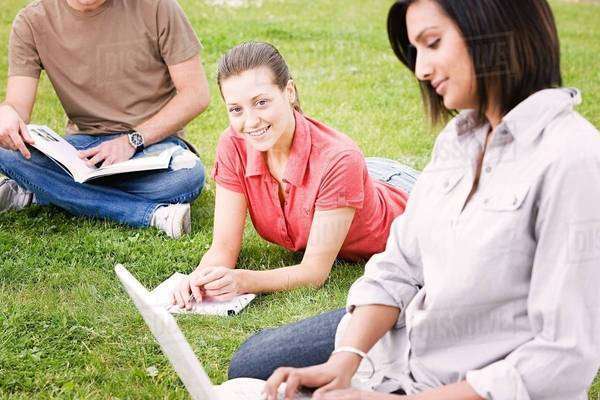 Students working outdoors - Stock Photo - Dissolve