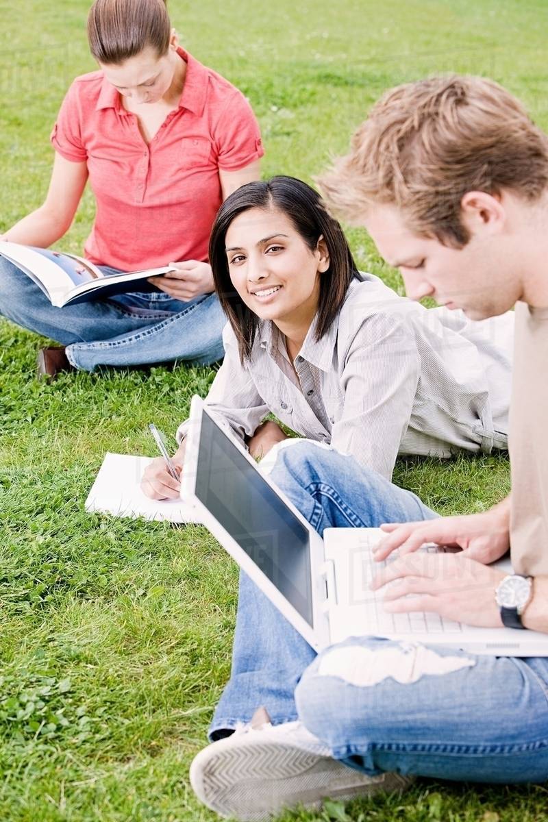 Students working outdoors - Stock Photo - Dissolve