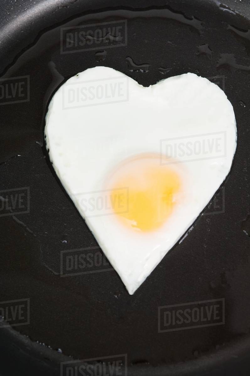 Heart shaped fried egg - Royalty-free Stock Photo | Dissolve