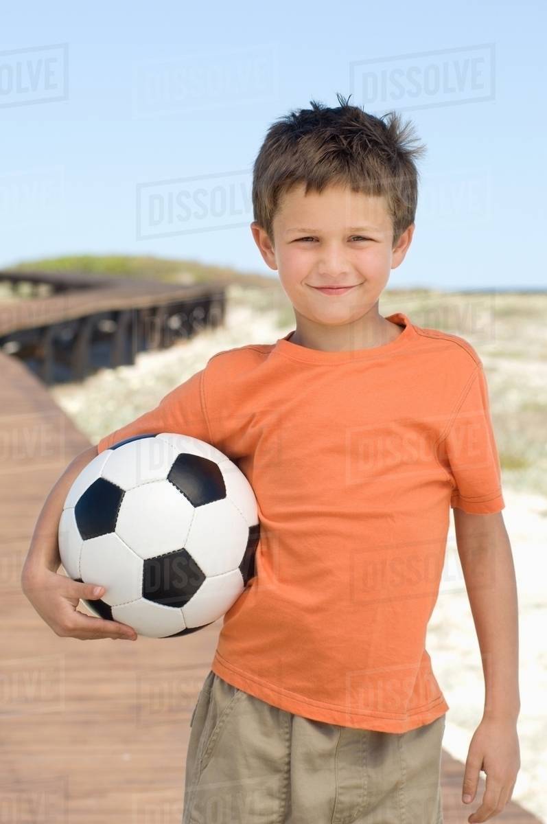 Boy with a football - Stock Photo - Dissolve