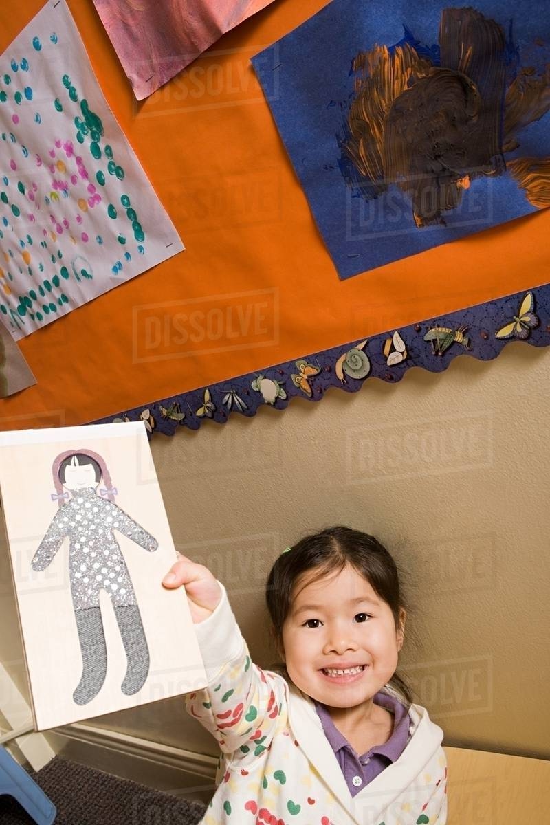 A girl showing a pencil drawing - Royalty-free Stock Photo | Dissolve