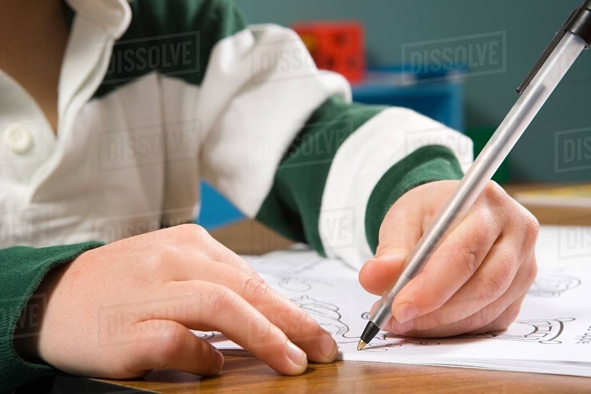 A boy writing - Royalty-free Stock Photo | Dissolve