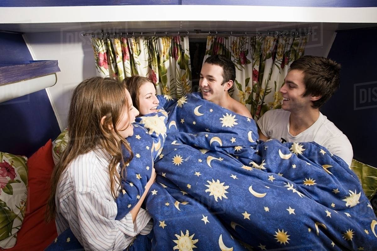 Teenage friends having a sleepover - Royalty-free Stock Photo | Dissolve
