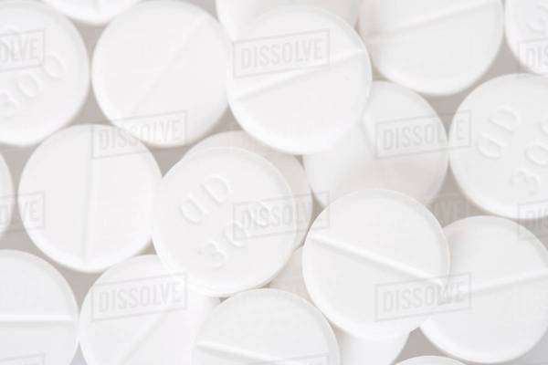 Close up of white pills - Stock Photo - Dissolve