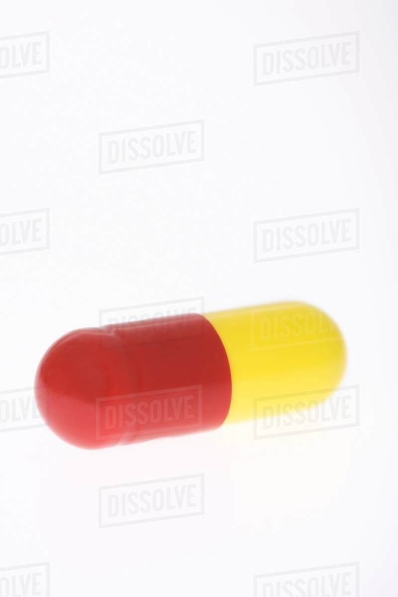 Red and yellow capsule - Royalty-free Stock Photo | Dissolve