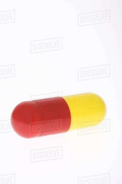 Red and yellow capsule - Royalty-free Stock Photo | Dissolve