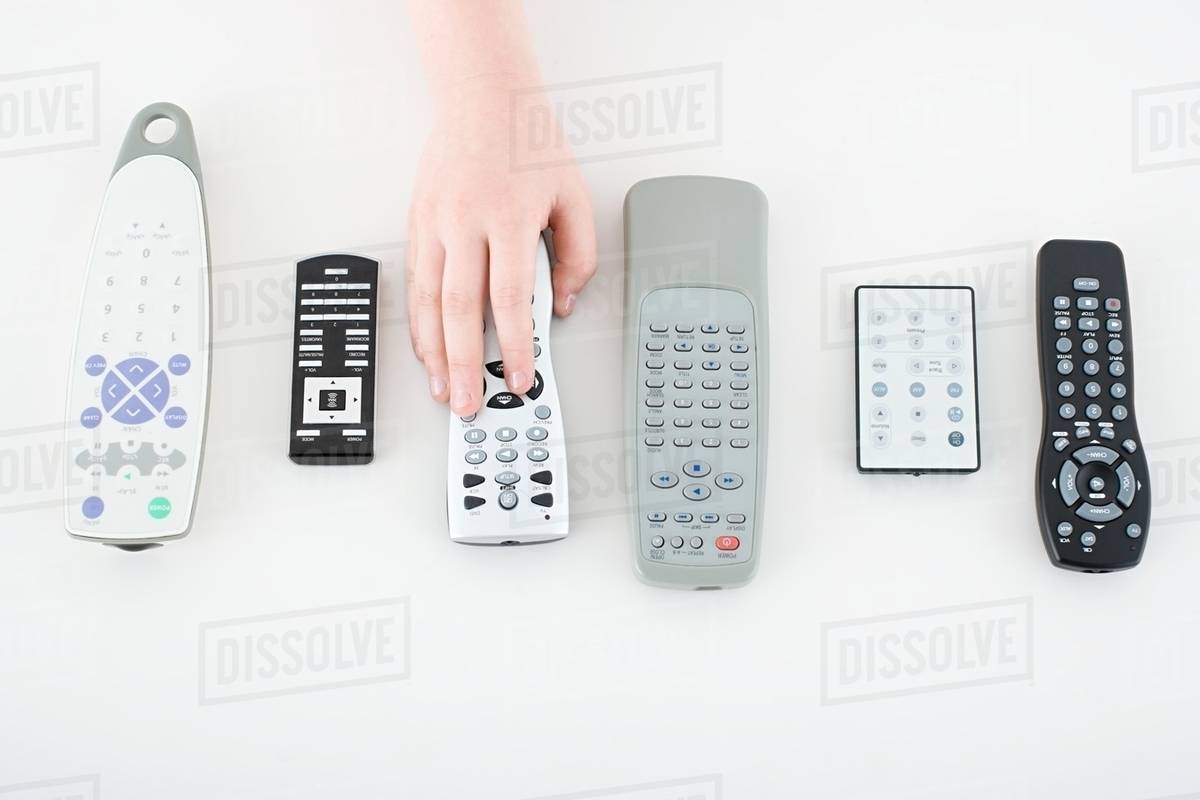 Child with remote controls - Royalty-free Stock Photo | Dissolve