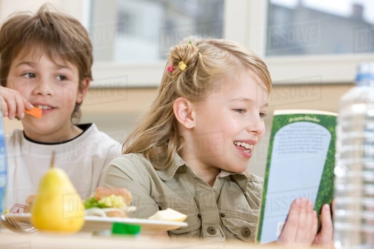 Children having lunch break - Royalty-free Stock Photo | Dissolve
