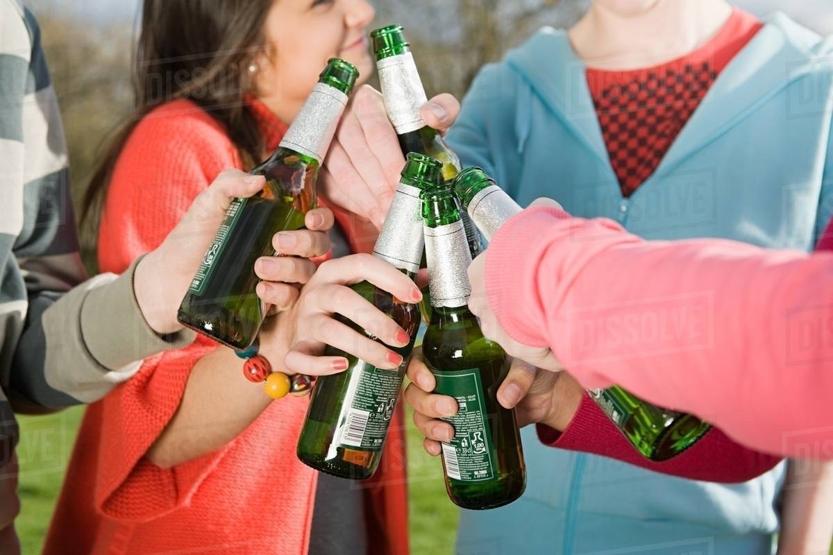 Teens with beer bottles - Royalty-free Stock Photo | Dissolve