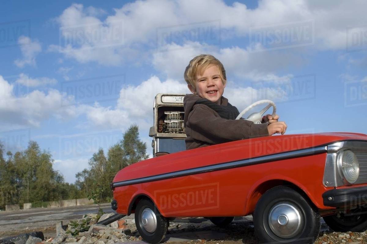 A boy in a toy car - Royalty-free Stock Photo | Dissolve