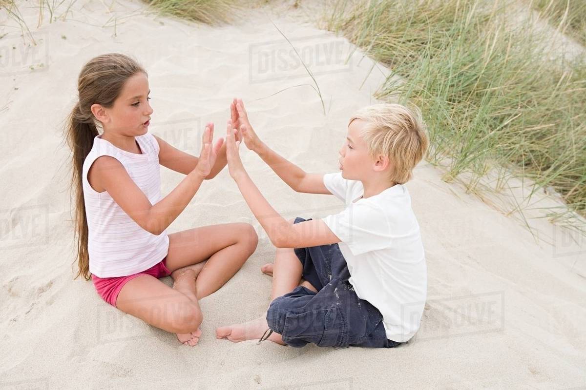 Children playing pat a cake - Royalty-free Stock Photo | Dissolve