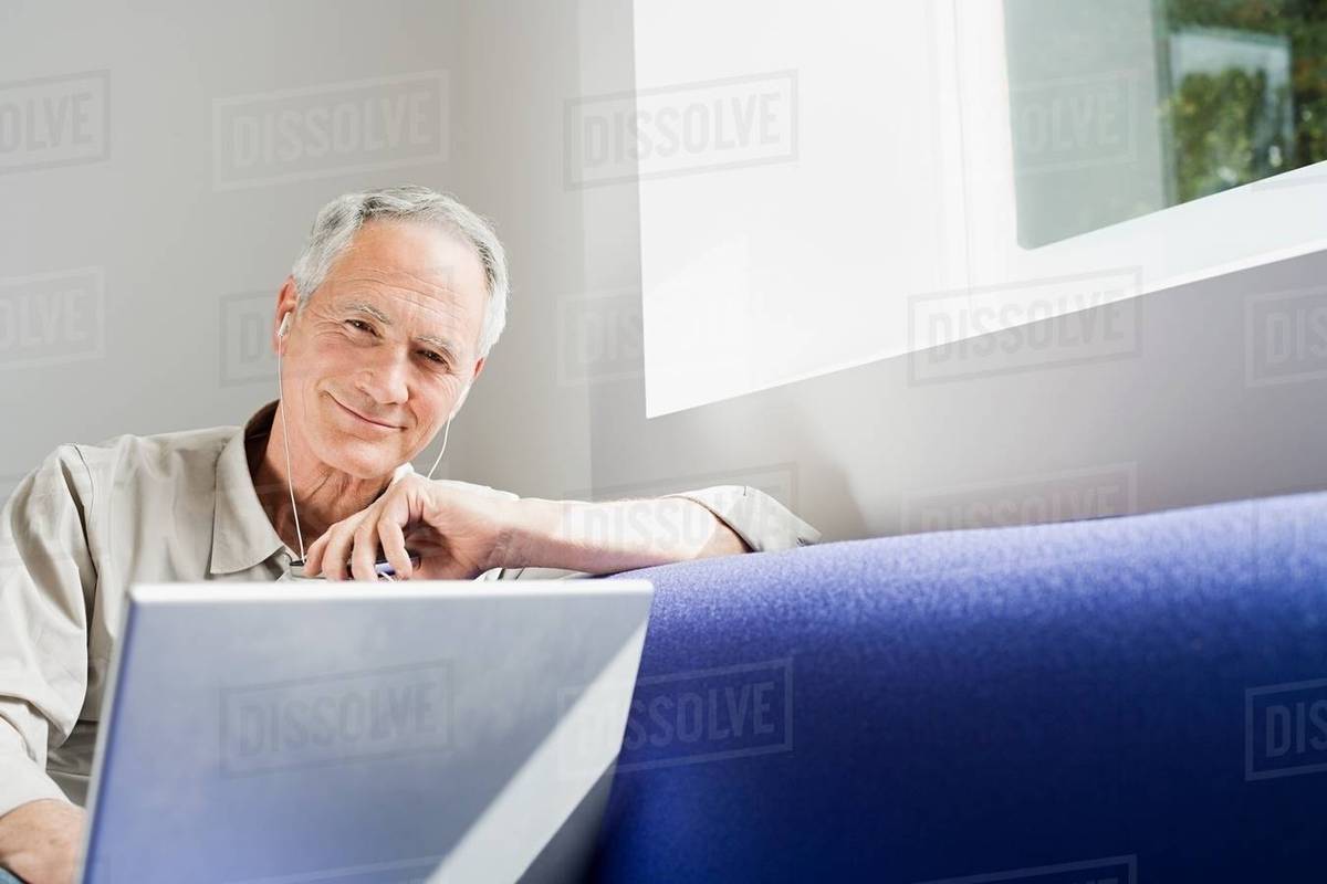 A man watching his laptop - Stock Photo - Dissolve