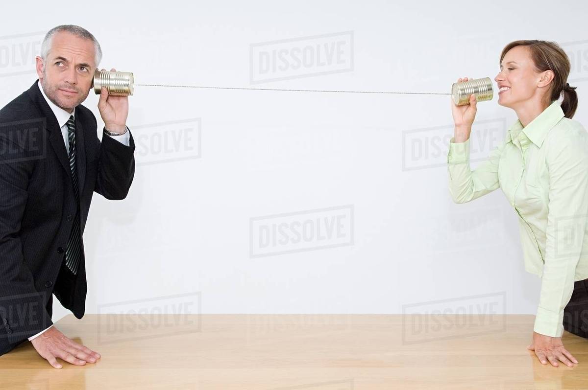 Businesspeople using a tin can telephone - Royalty-free Stock Photo ...