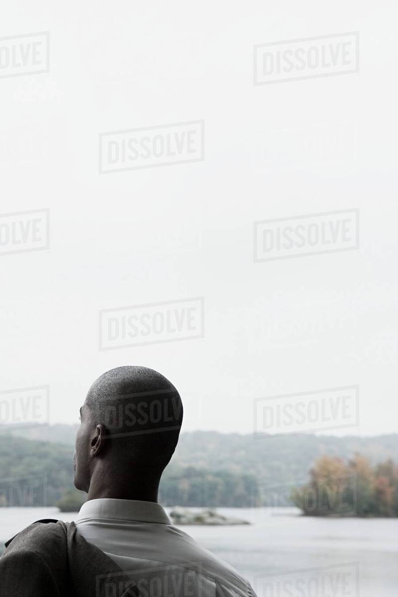 A businessman holding a jacket - Royalty-free Stock Photo | Dissolve