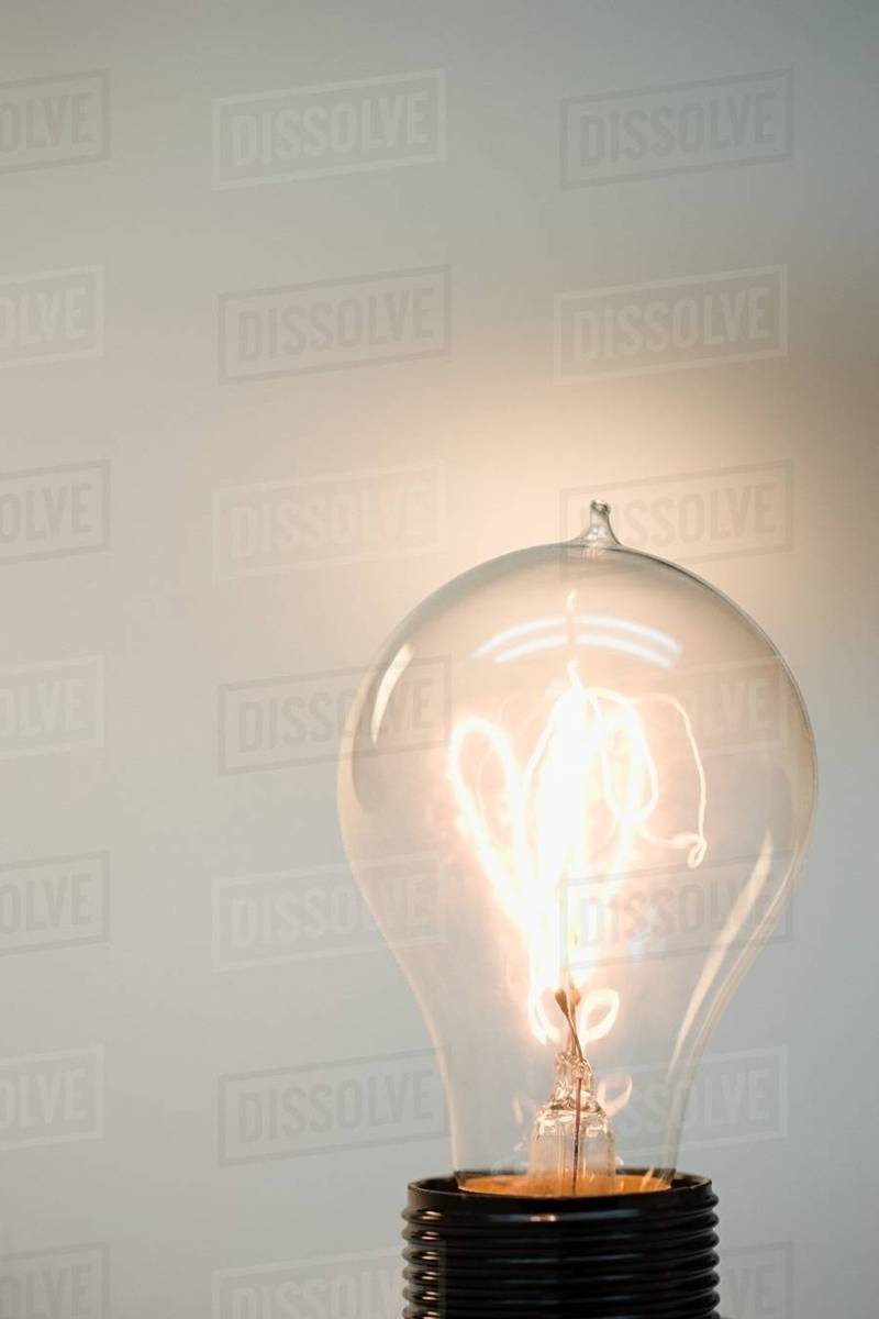 An illuminated lightbulb - Stock Photo - Dissolve
