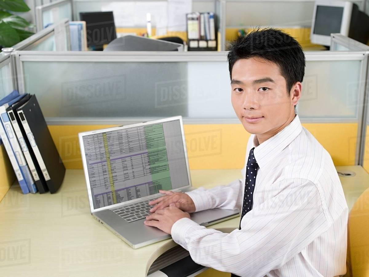Office worker with laptop - Royalty-free Stock Photo | Dissolve