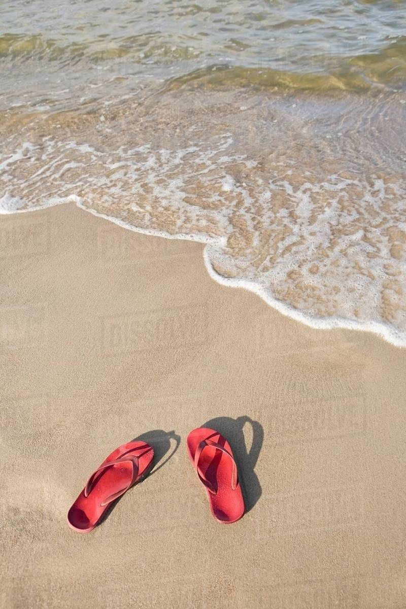 Flip flops on a beach - Royalty-free Stock Photo | Dissolve