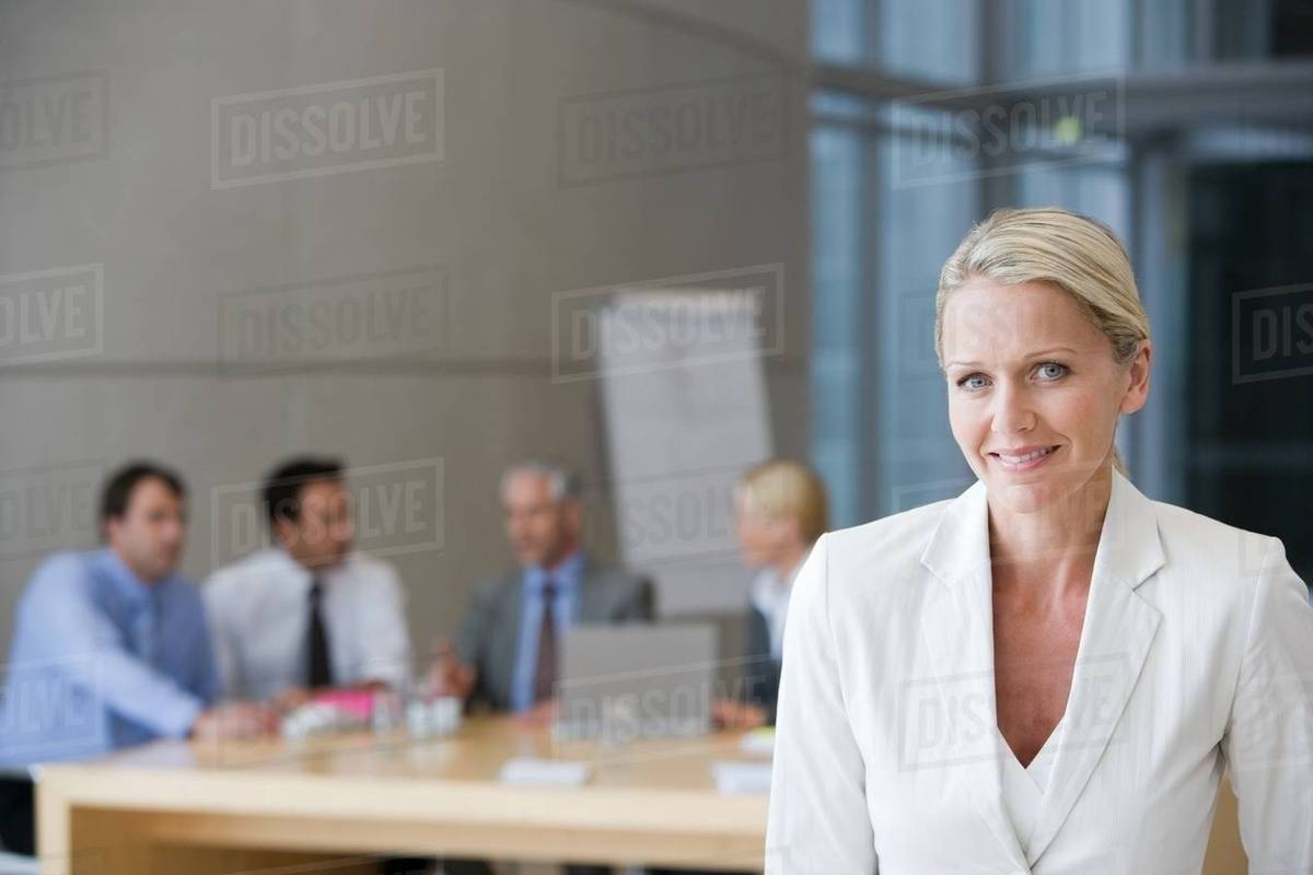 Female manager with team - Royalty-free Stock Photo | Dissolve