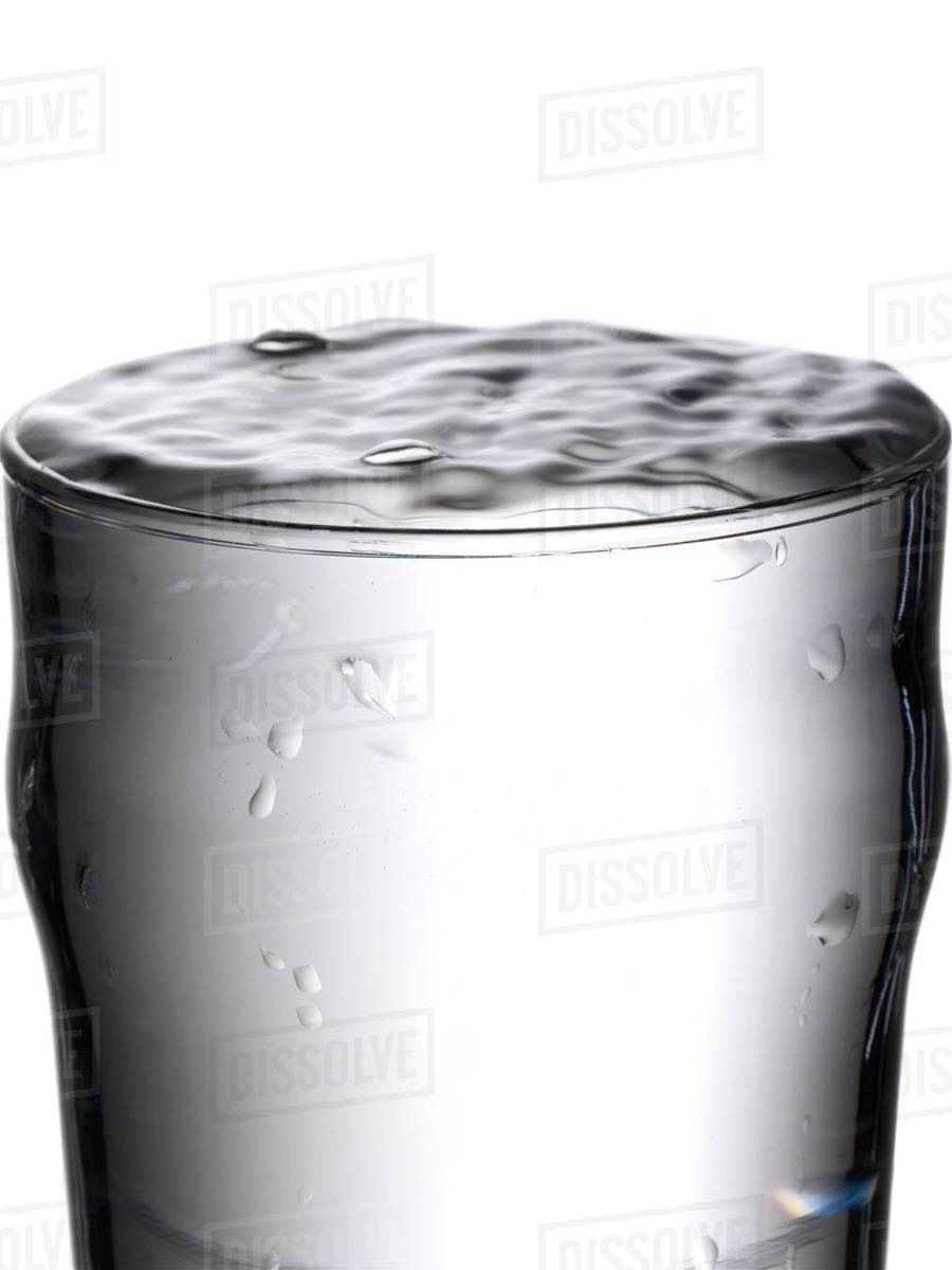 Glass full of water - Stock Photo - Dissolve