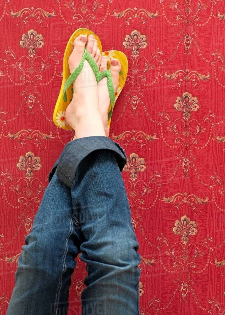 Person with feet on wall - Royalty-free Stock Photo | Dissolve