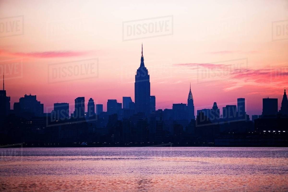 Manhattan skyline at sunset - Stock Photo - Dissolve