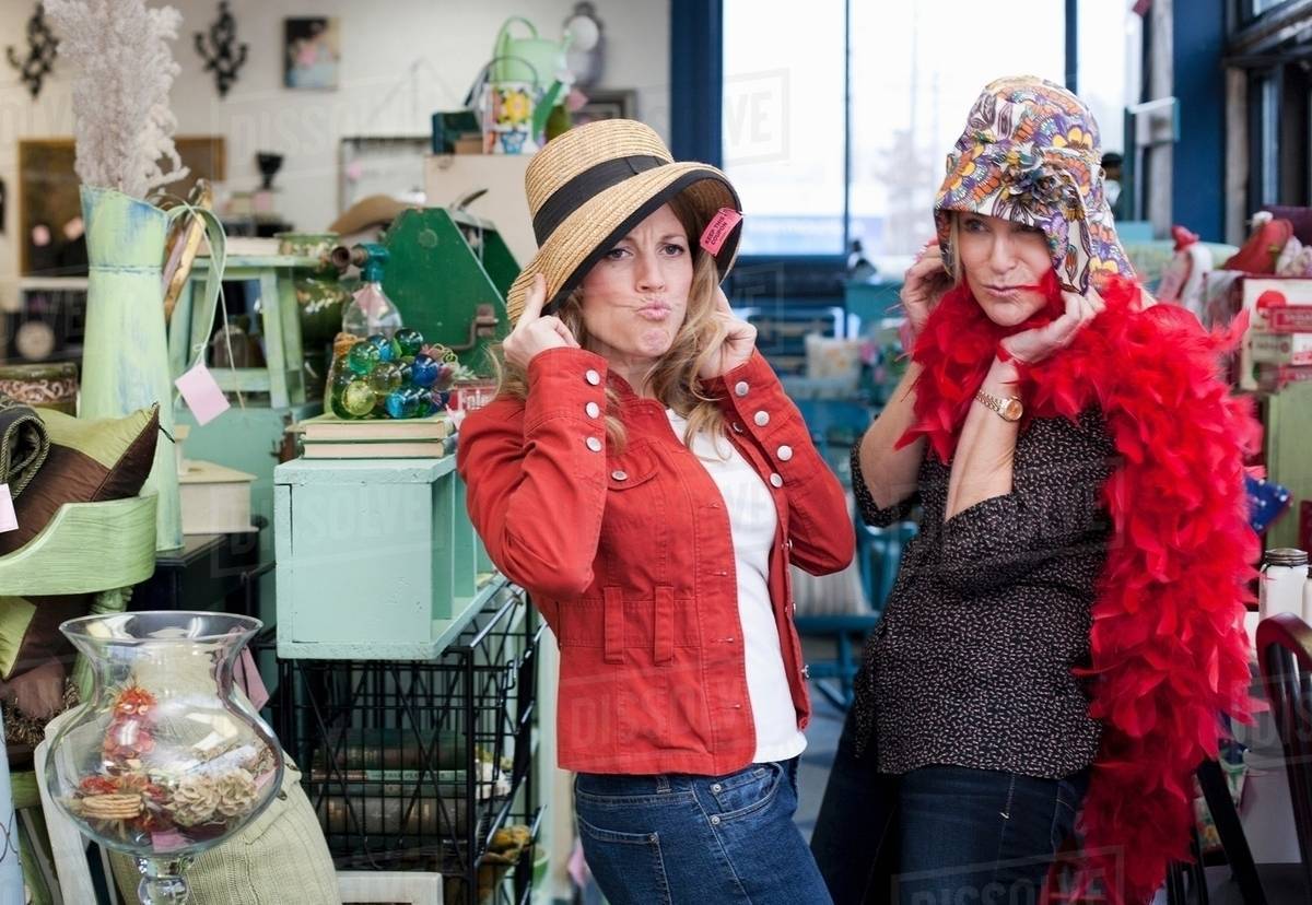 Women shopping in thrift store - Stock Photo - Dissolve