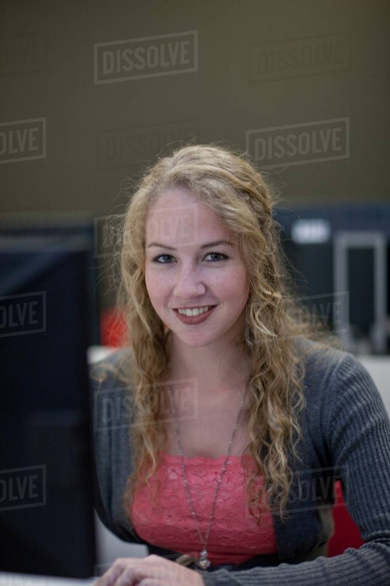 Female student using computer in class - Royalty-free Stock Photo ...