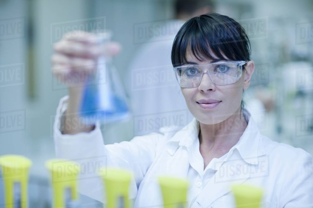 Oenologist checking laboratory tests - Stock Photo - Dissolve