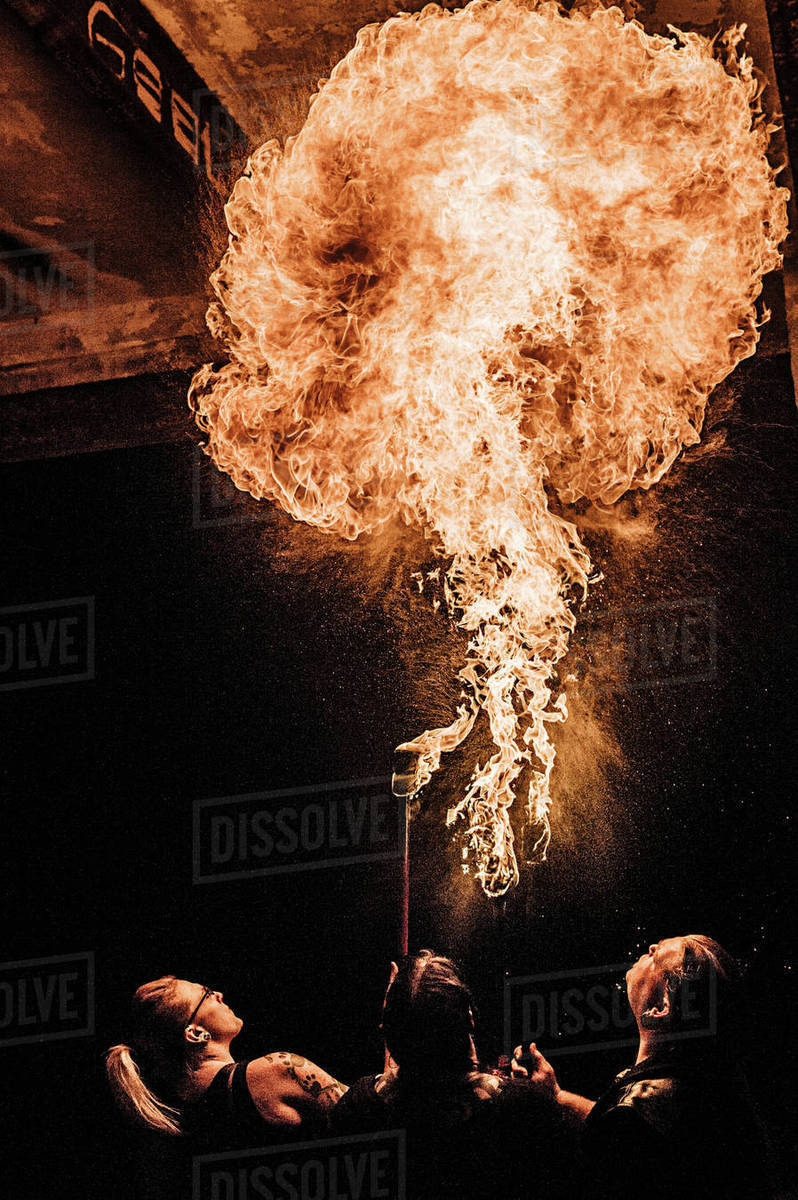 Rear view of performers fire breathing - Royalty-free Stock Photo ...