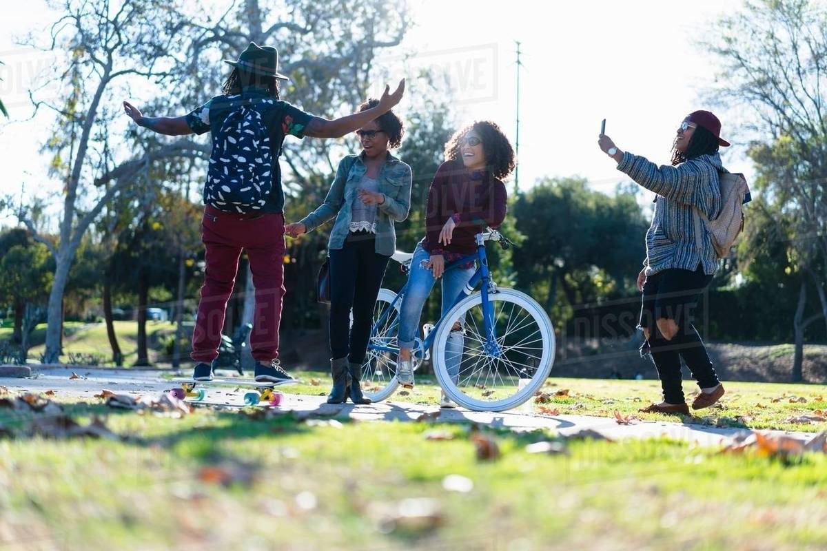 Group of female friends fooling around in park - Royalty-free Stock ...