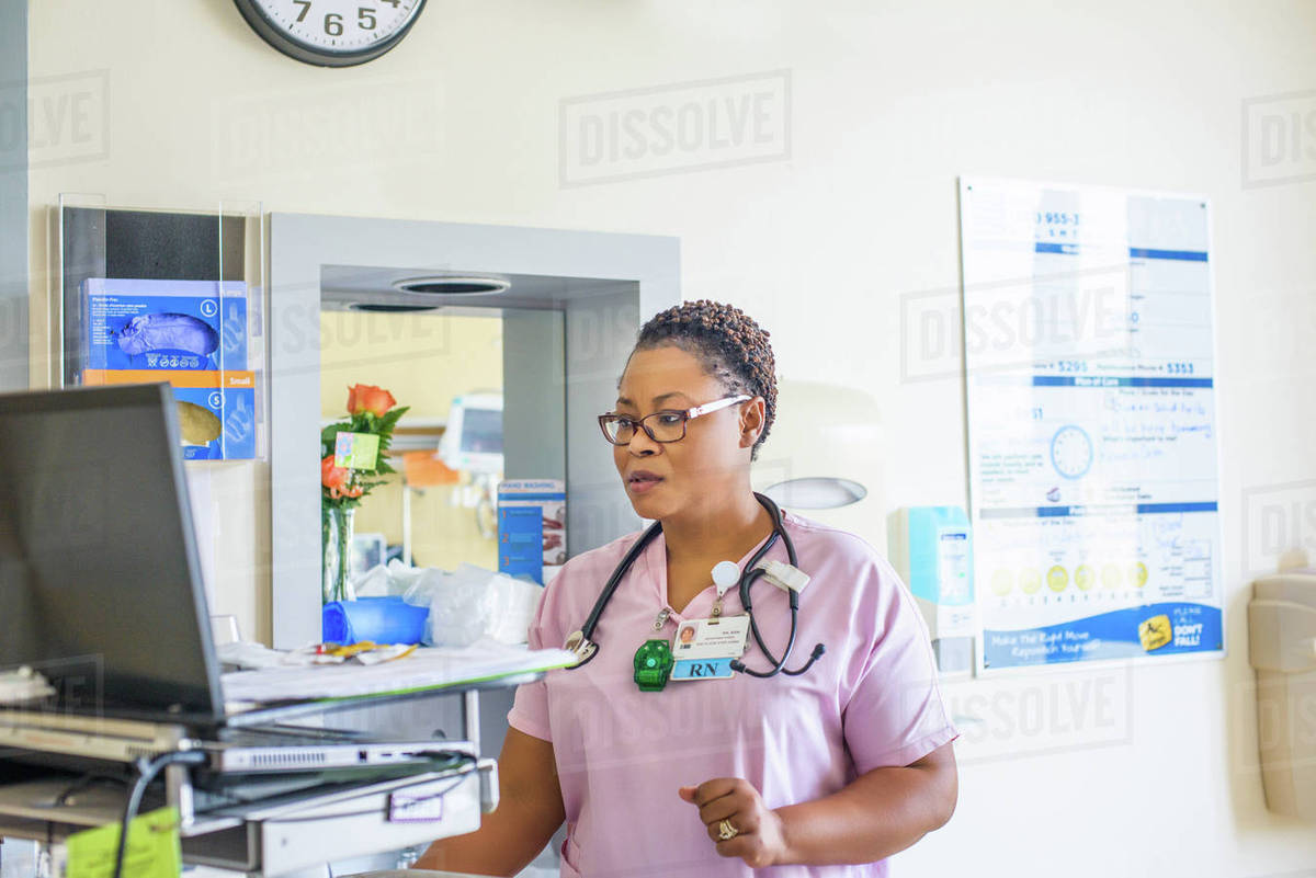 Nurse working in hospital - Stock Photo - Dissolve