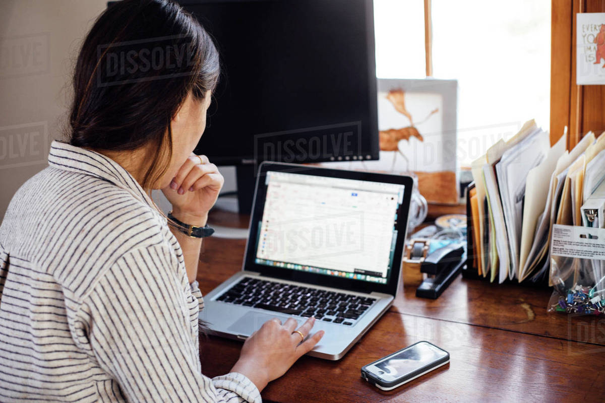 View over shoulder of woman using laptop - Royalty-free Stock Photo ...