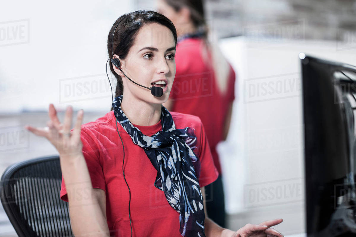 Female telephonist explaining in call centre - Royalty-free Stock Photo ...