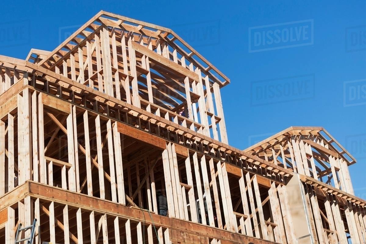 Wooden construction frame against blue sky - Royalty-free Stock Photo ...