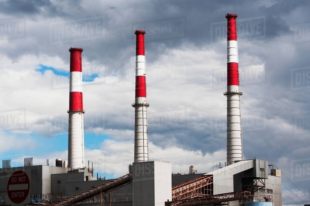Smoke stacks of power plant - Royalty-free Stock Photo | Dissolve