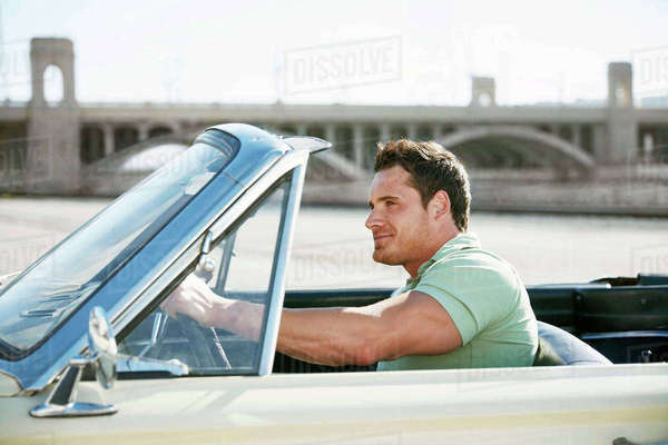 Man driving convertible car, Los Angeles, California, USA - Royalty ...