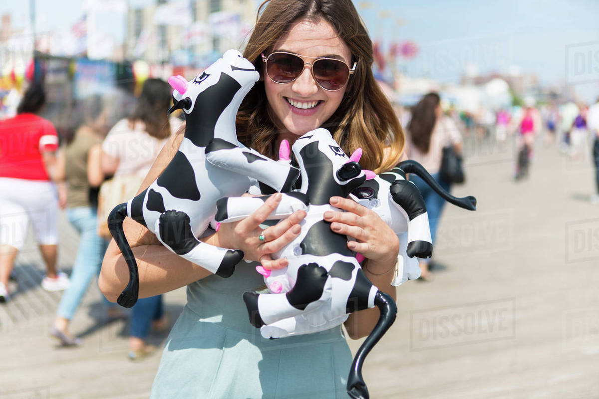 Couple holding cuddly toy cows smiling, Coney island, Brooklyn, New ...
