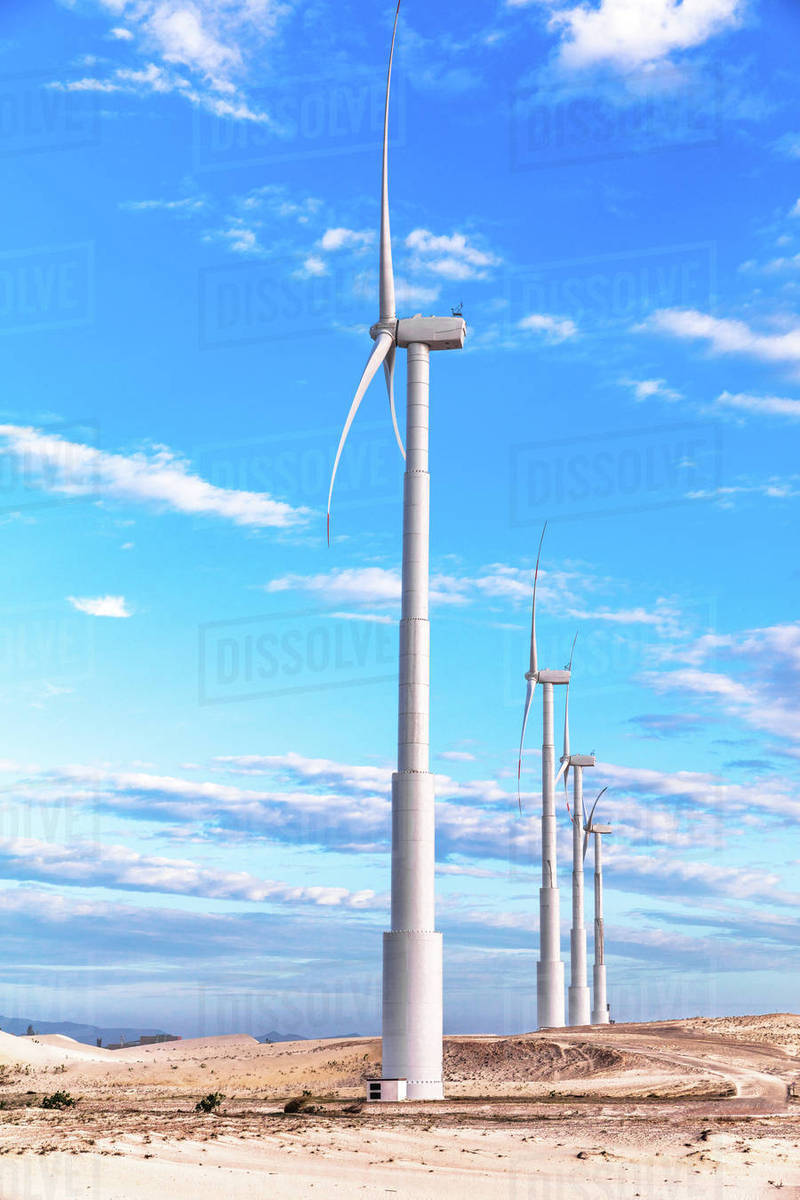 Row of wind turbines in desert, Taiba, Ceara, Brazil - Royalty-free ...