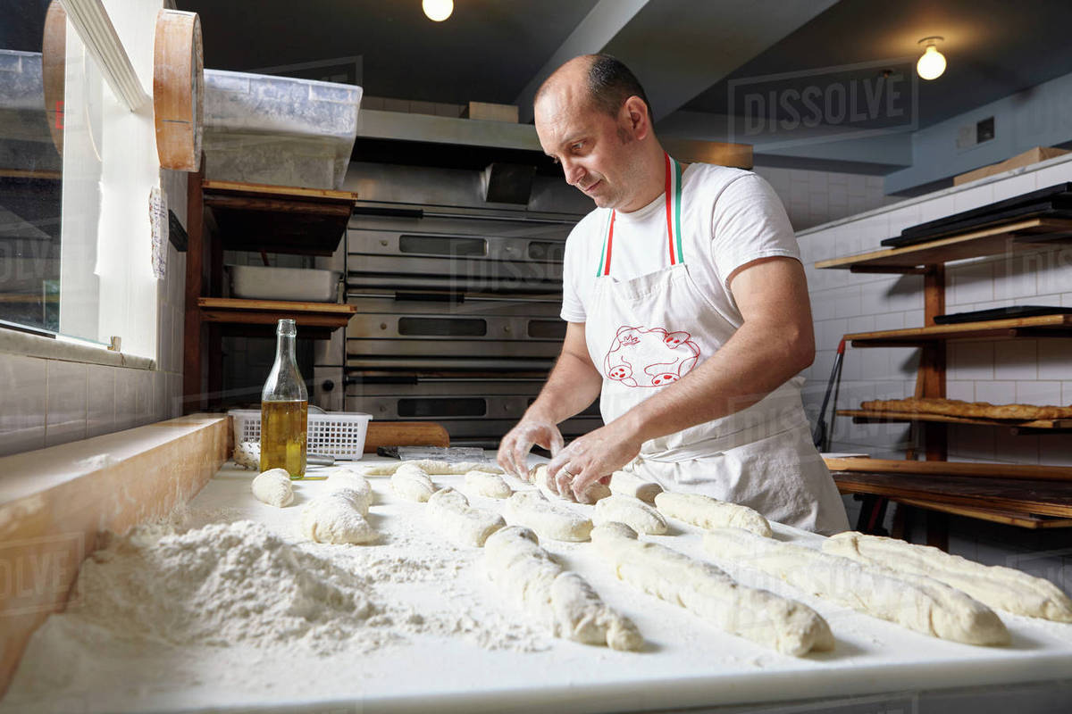 baker-working-in-bakery-stock-photo-dissolve