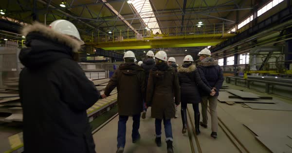 Factory Inspection. group of visitors on the factory tour. Russia ...