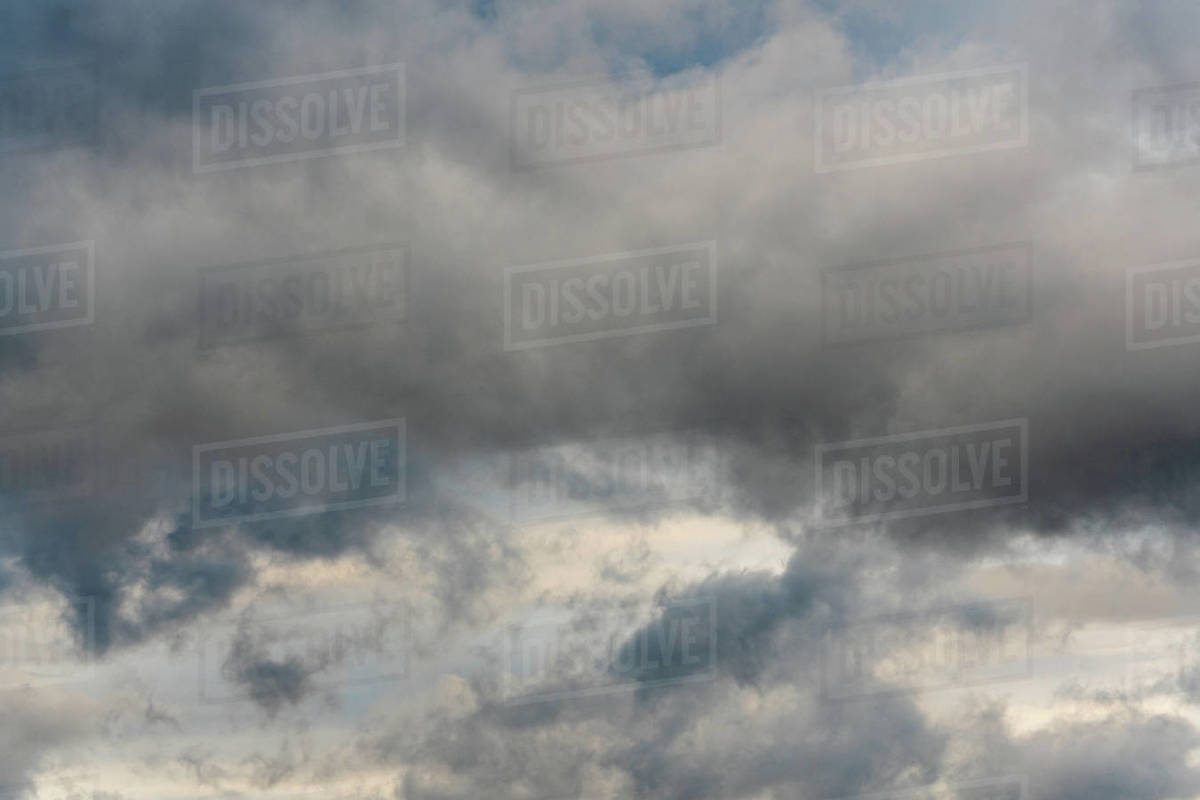 Stunning thunderclouds in dusk sky, rainy and overcast weather. Scenery ...