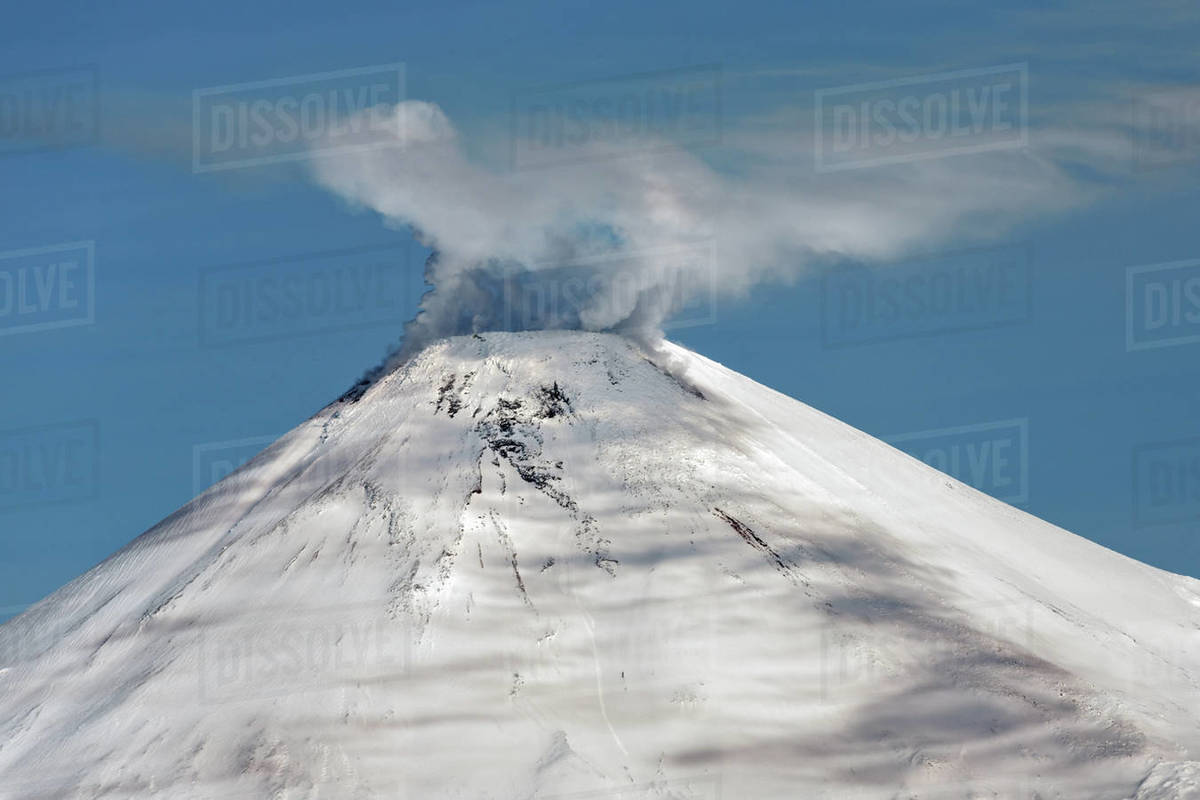 Beautiful volcanic landscape: view of snowy cone of Avachinsky Volcano ...