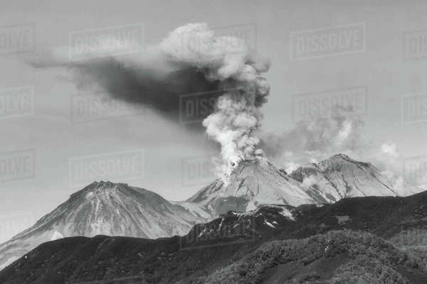 Mountain landscape of Kamchatka Peninsula, dramatic view of eruption of ...