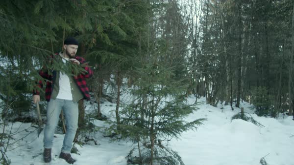 Brutal lumberjack walks through the winter forest - Stock Video Footage ...